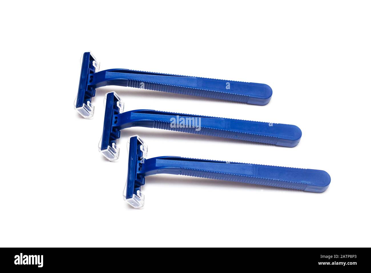 Three blue razors isolated on a white background Stock Photo - Alamy