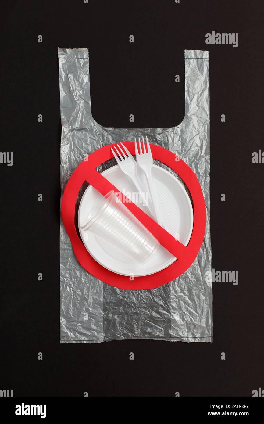 Stop sign on a plastic dishes. Sign prohibiting the use of plastic ...