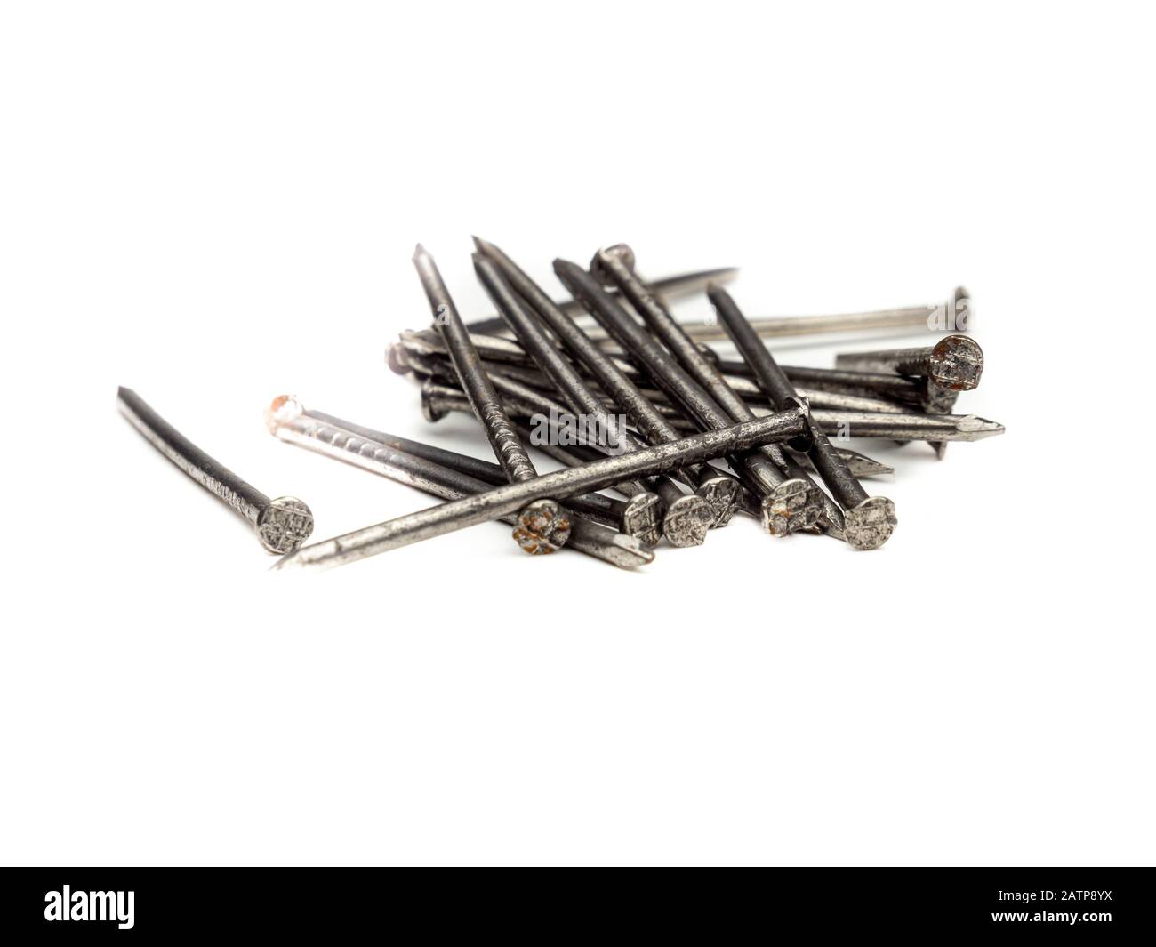 many Nails on white background Stock Photo - Alamy