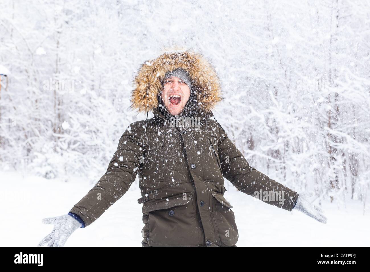 Happy funny male portrait looking snowflakes falling down Stock Photo ...