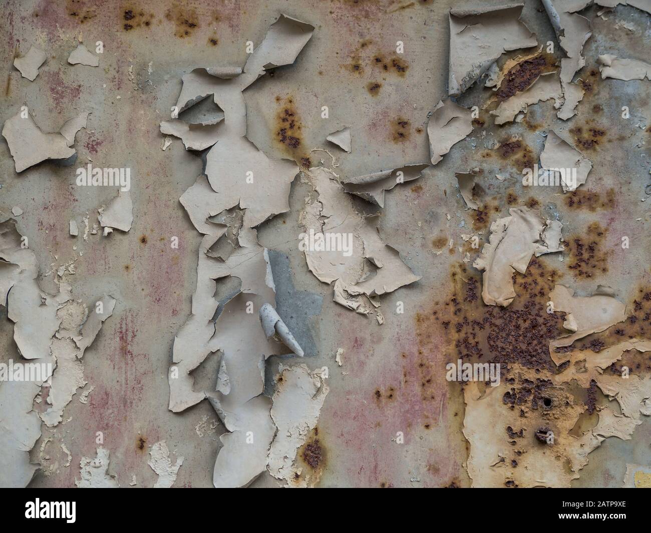 Rust flaking off a wall Stock Photo - Alamy