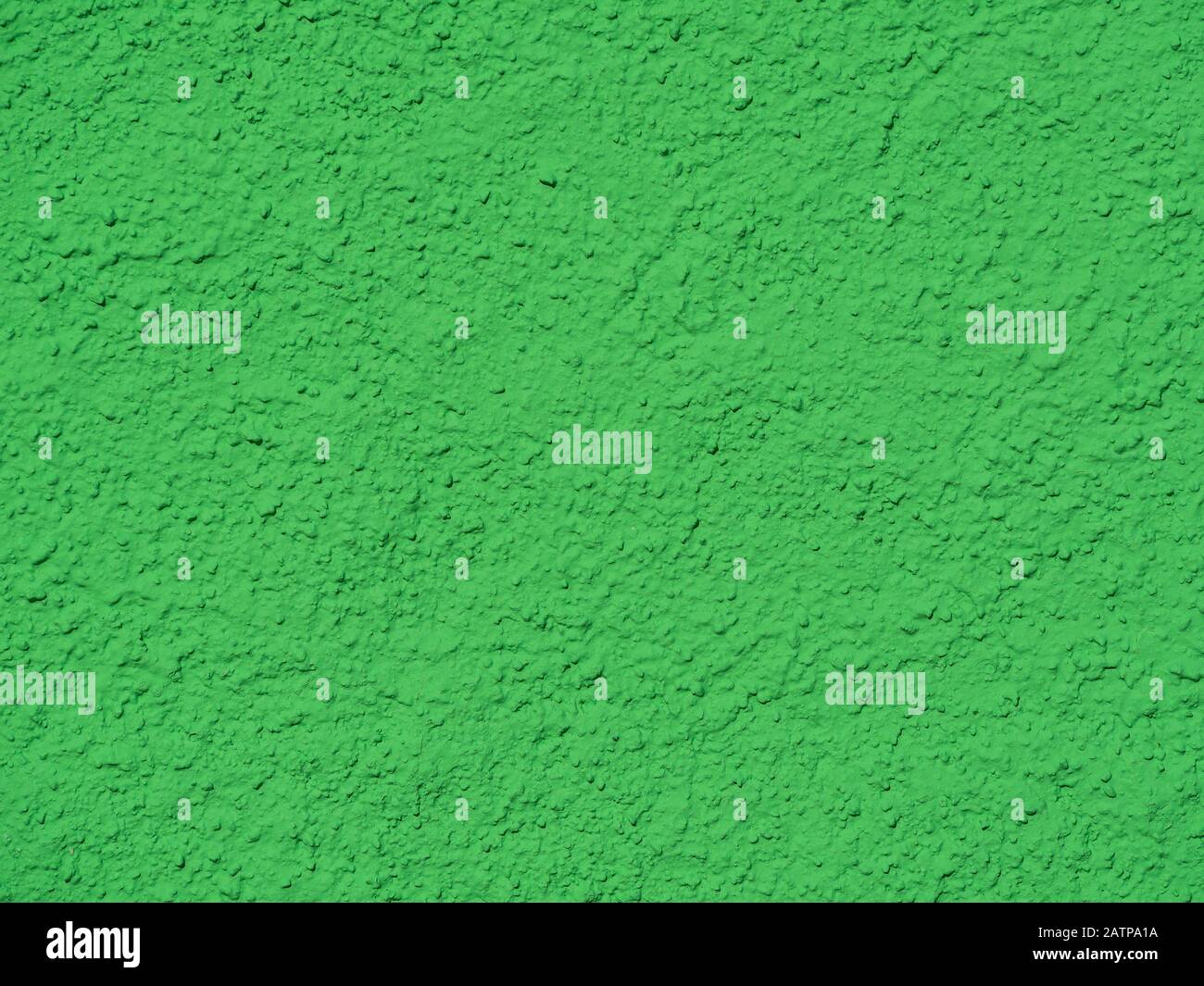 green textured plaster on a wall Stock Photo - Alamy