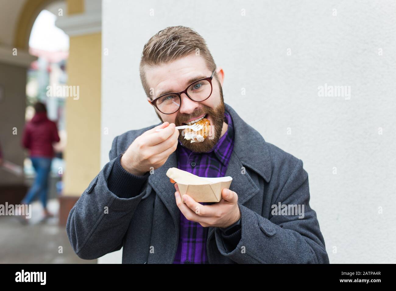 Fast Food And Meal Concept Young Man Eating Take Away Food On The