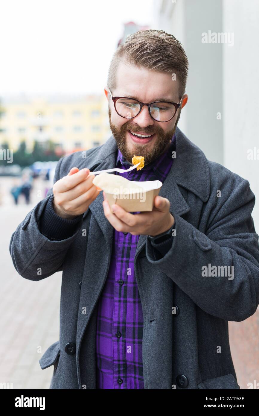 Young man eats junk food hi-res stock photography and images - Alamy