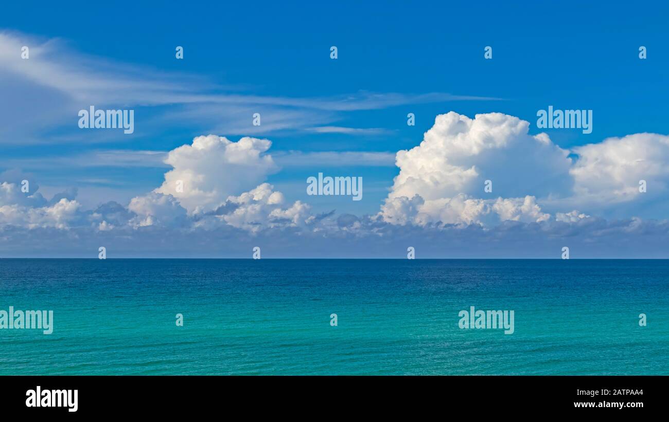 Cumulus clouds over tropical ocean Stock Photo - Alamy