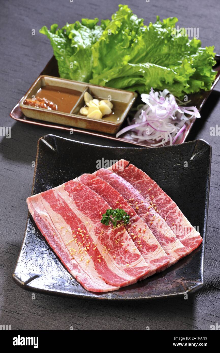 The portrait of food sliced beef and source Stock Photo - Alamy