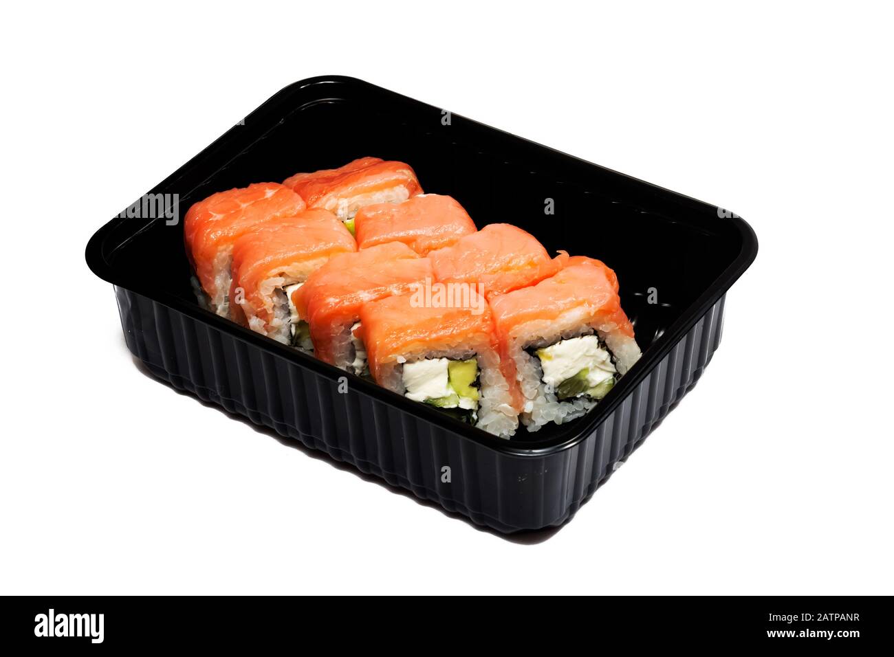 Salmon rolls in black box, isolated on white background Stock Photo - Alamy