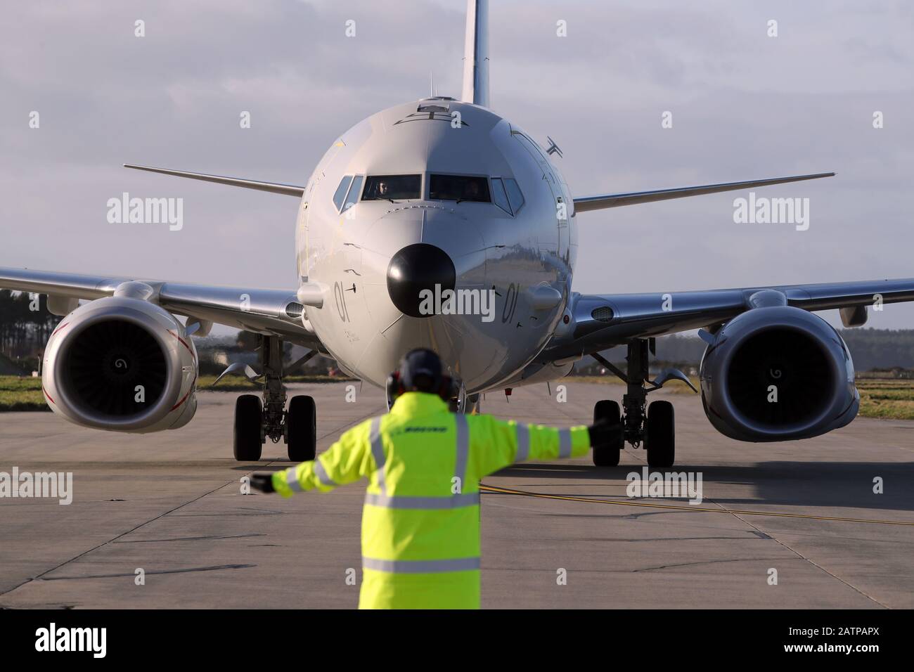 A member of the ground crew directs the UK's first submarine-hunting P ...