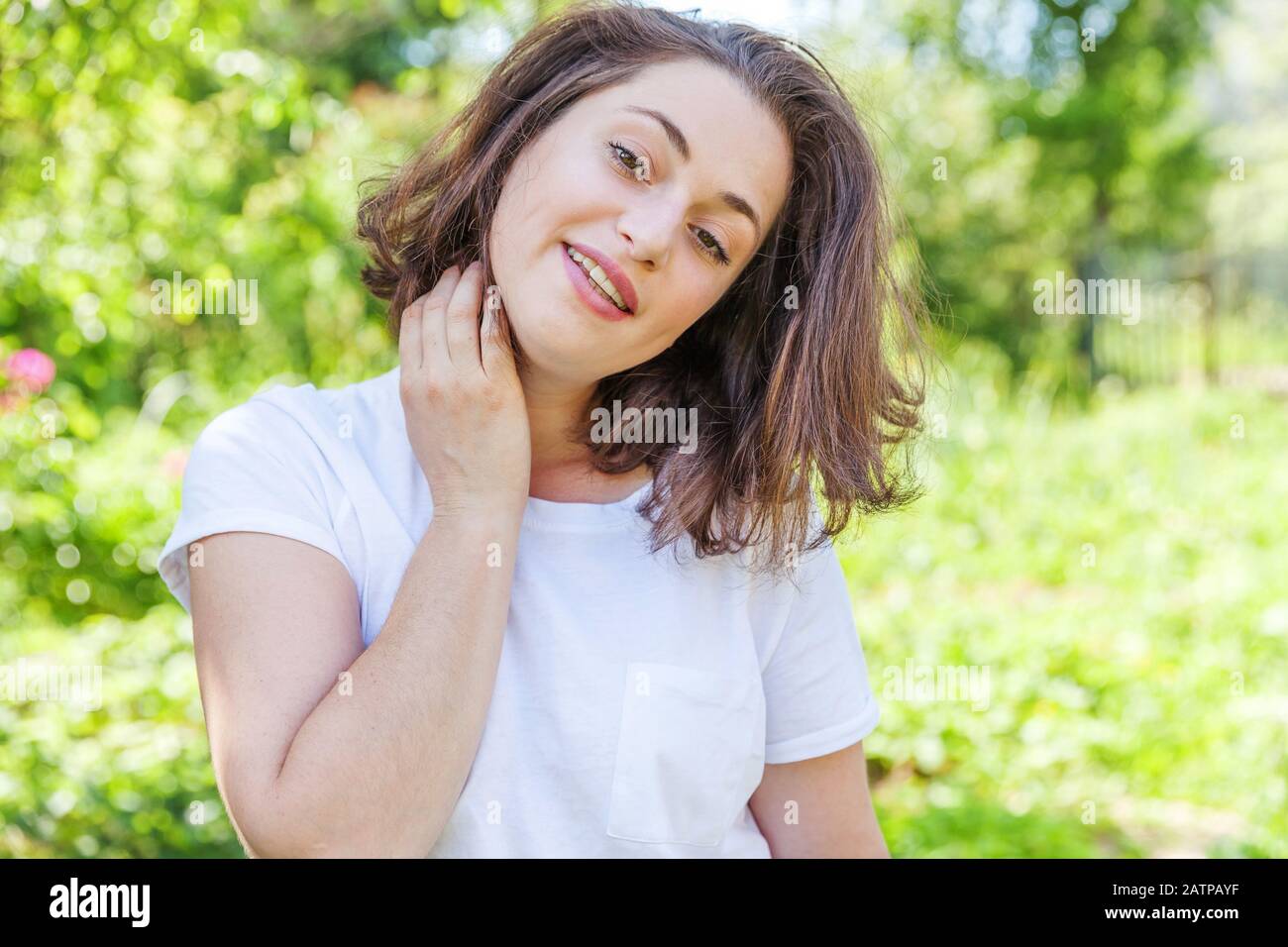 Happy girl smiling outdoor. Beautiful young brunete woman with brown ...