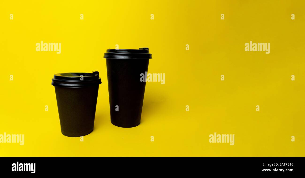 Small and big coffee black paper cups with black caps Stock Photo - Alamy