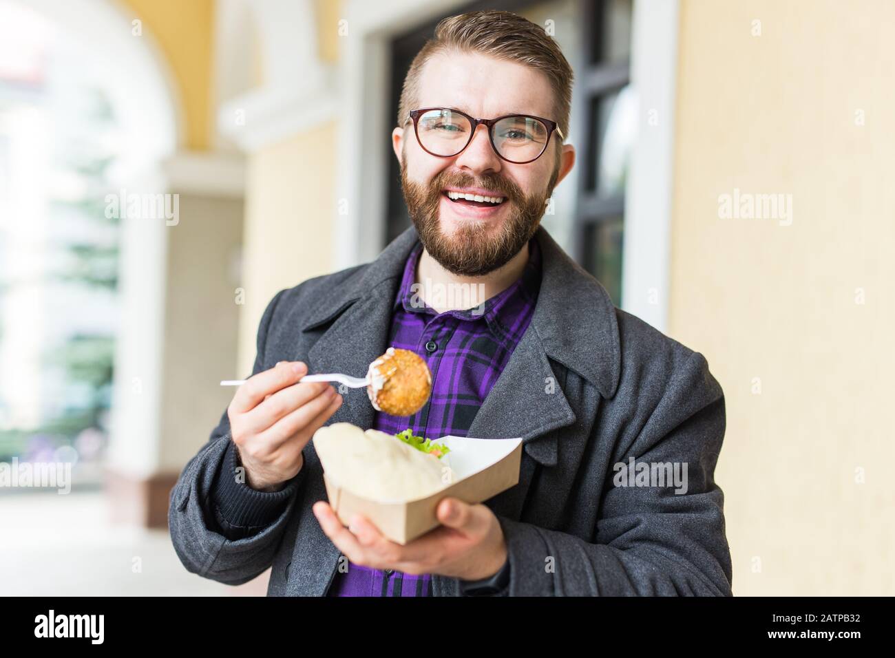 Man holding one-off plate with traditional delicious jewish food ...