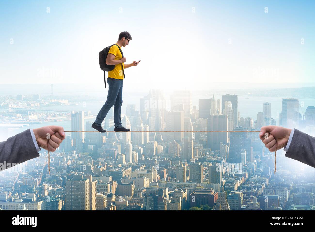 The student walking on tight rope Stock Photo - Alamy