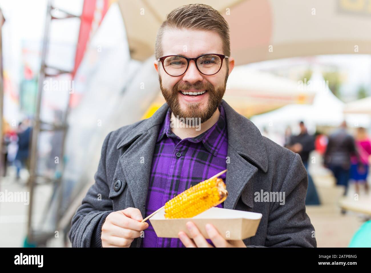 Handsome man eating roasted hi-res stock photography and images - Alamy