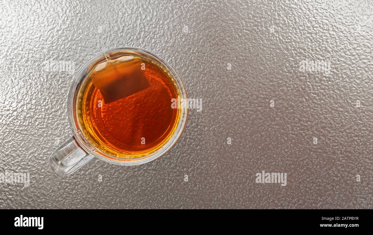 Tea glass overhead against tempered glass background Stock Photo - Alamy