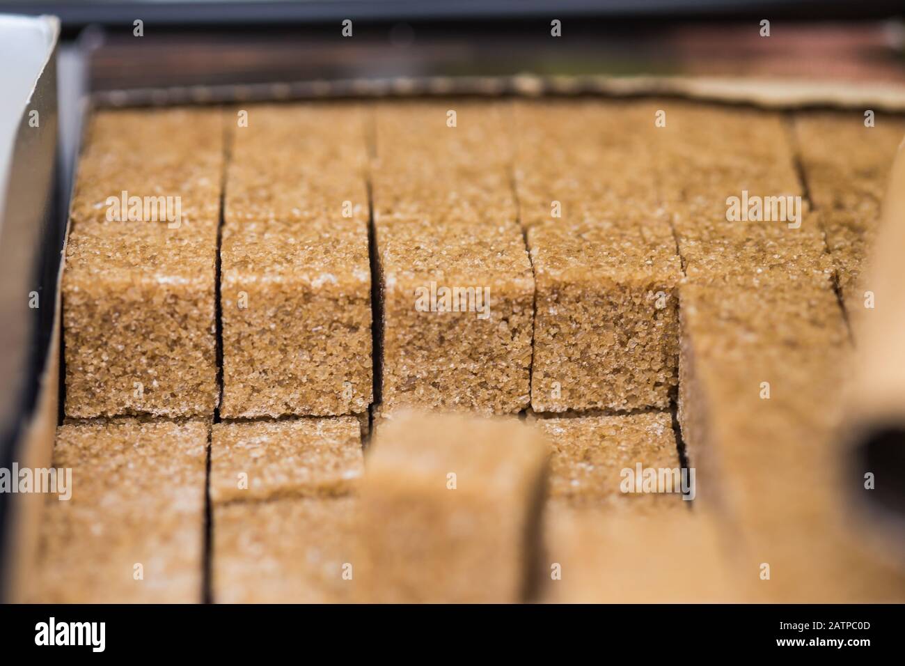 Granulated brown lump sugar. Brown cane sugar Stock Photo - Alamy