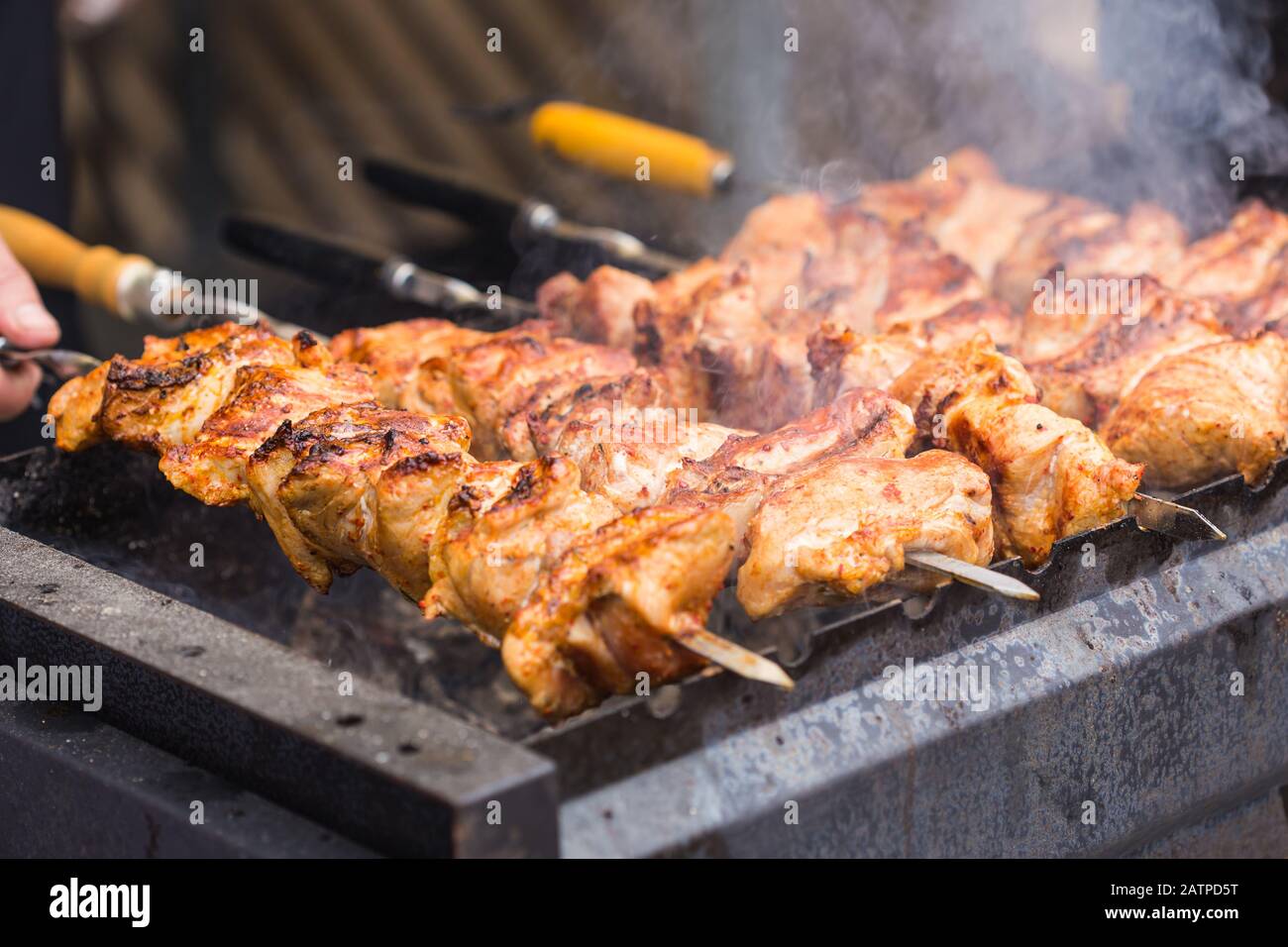 Delicious bbq kebab grilling on open grill, outdoor kitchen. Food ...