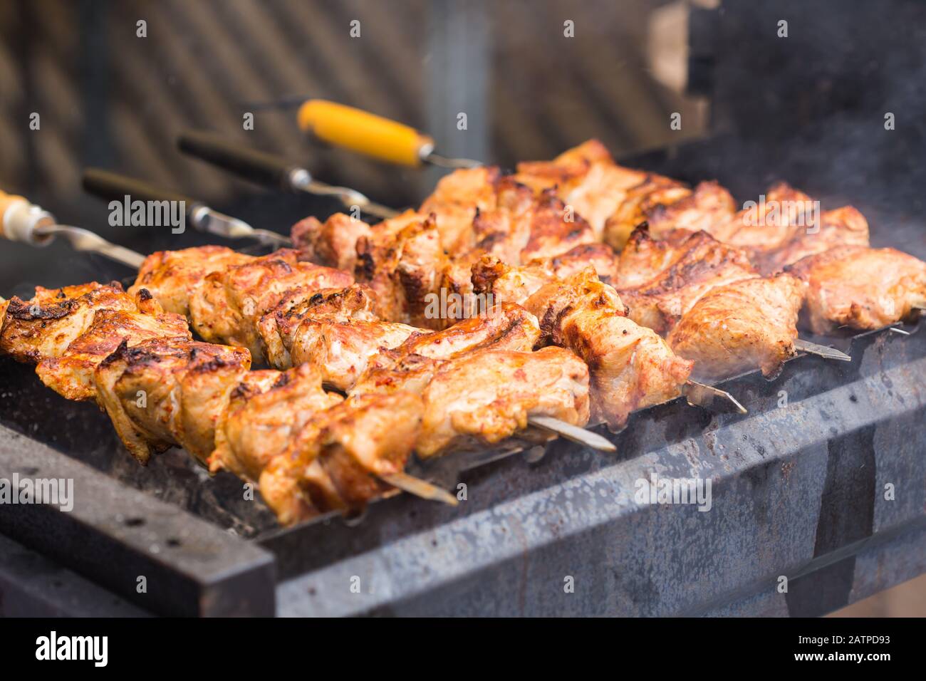 Delicious bbq kebab grilling on open grill, outdoor kitchen. Food ...