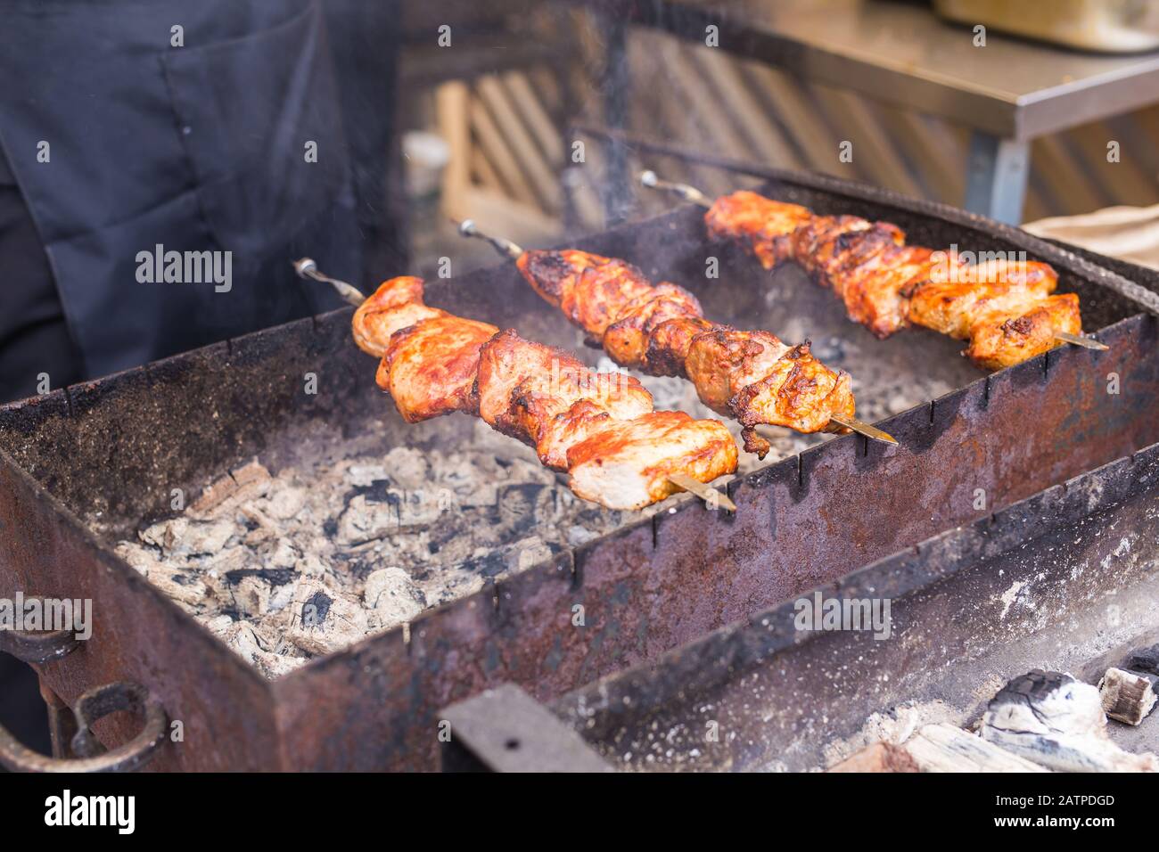 Delicious bbq kebab grilling on open grill, outdoor kitchen. Food ...