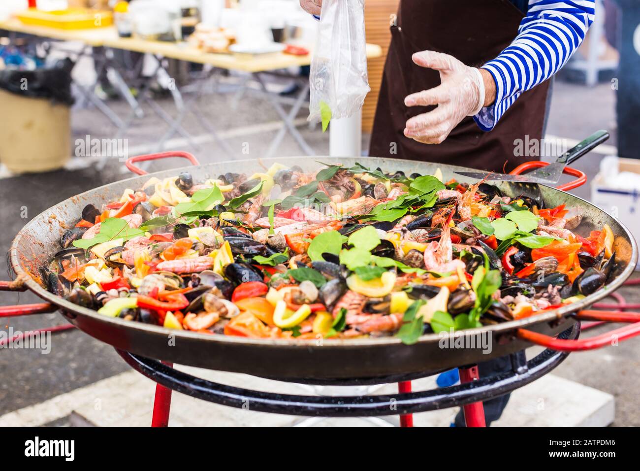 Spanish paella prepared in the street restaurant Stock Photo - Alamy