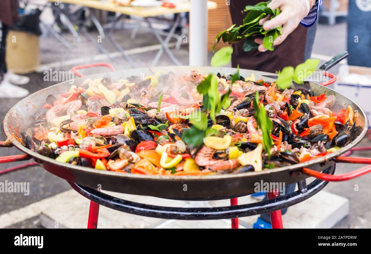 Spanish paella prepared in the street restaurant Stock Photo - Alamy