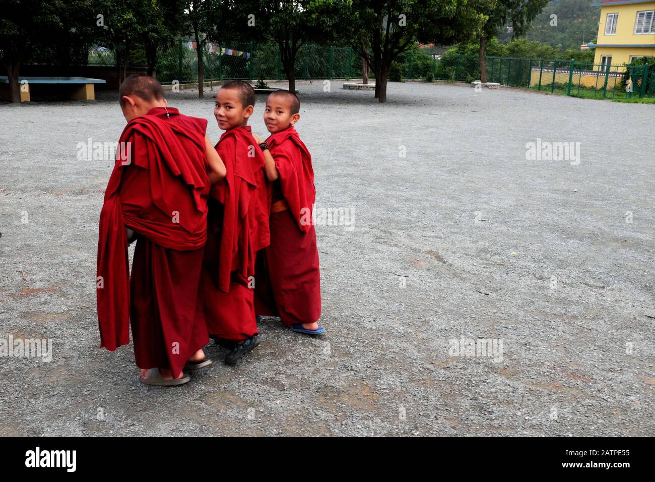 Three buddhist monks walking hi-res stock photography and images - Alamy