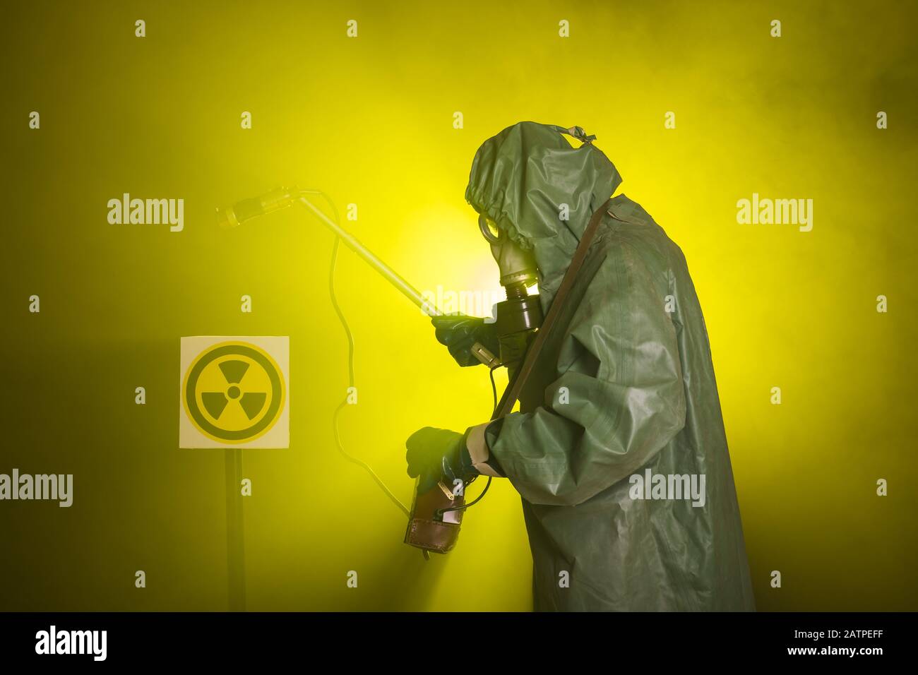 Radiation and danger concept - Man in old protective hazmat suit Stock ...