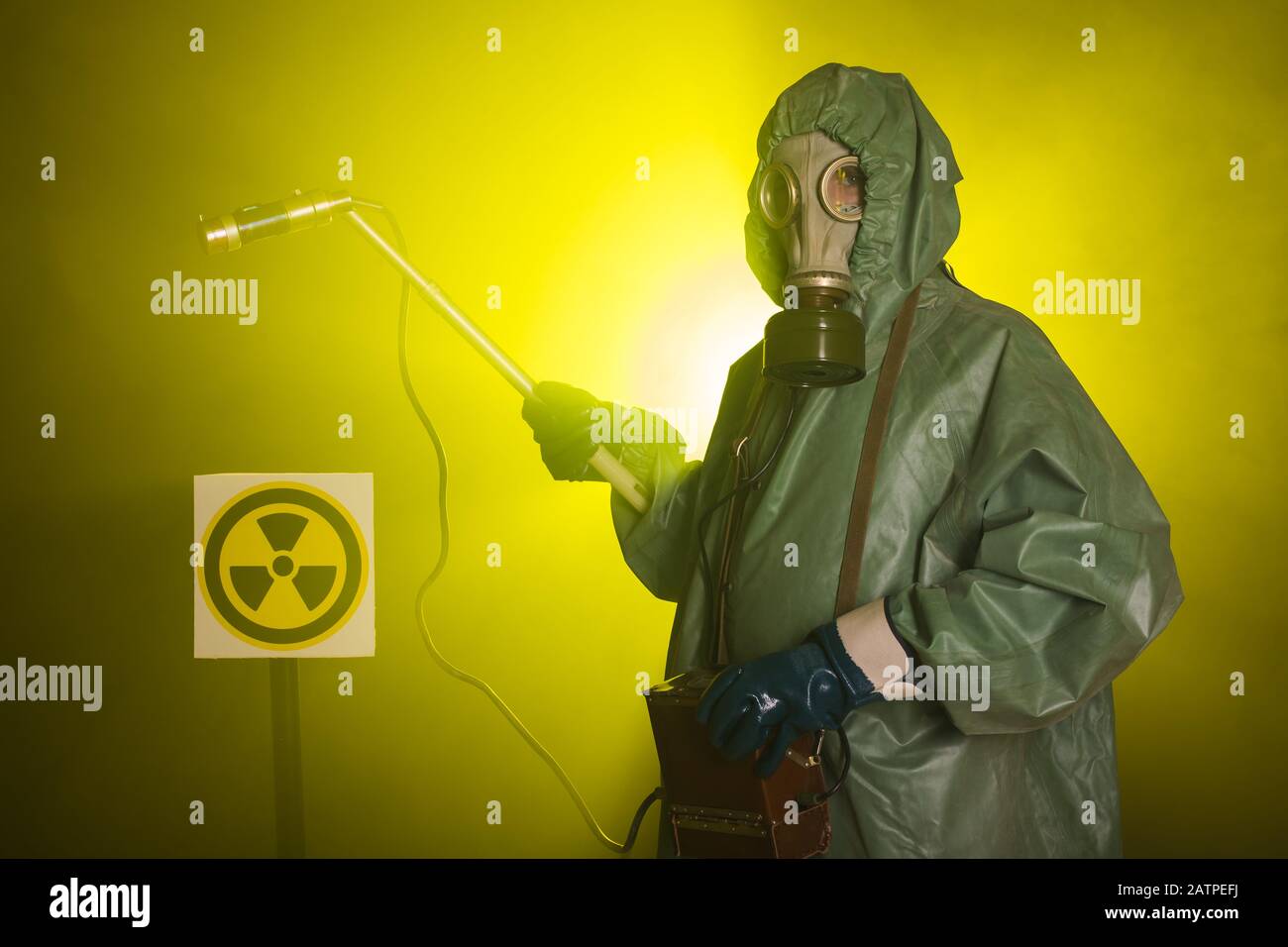 Radiation and danger concept - Man in old protective hazmat suit Stock ...