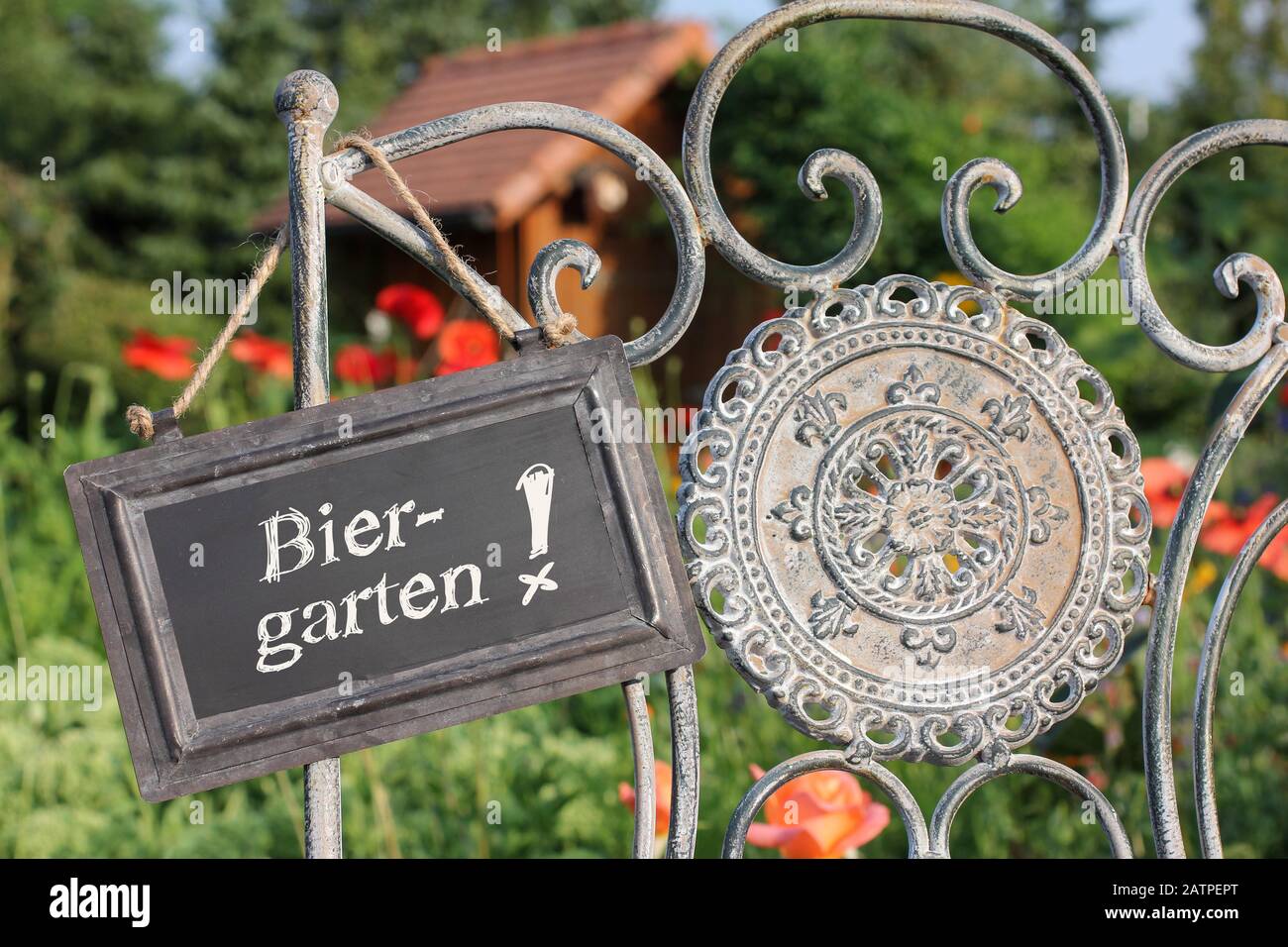 Chair with blackboard, beer garden Stock Photo - Alamy