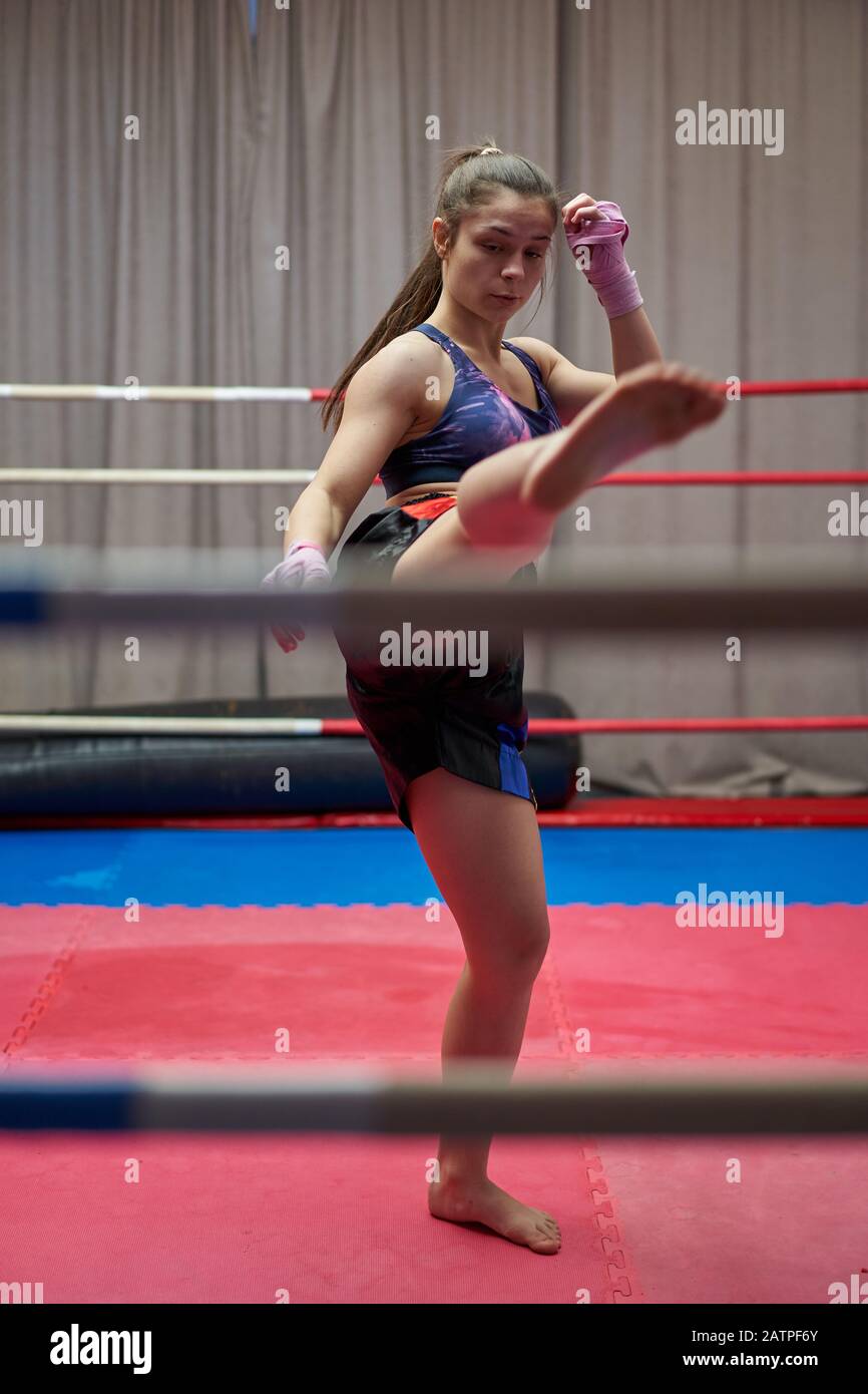 Kickboxing girl doing shadow boxing drill Stock Photo - Alamy