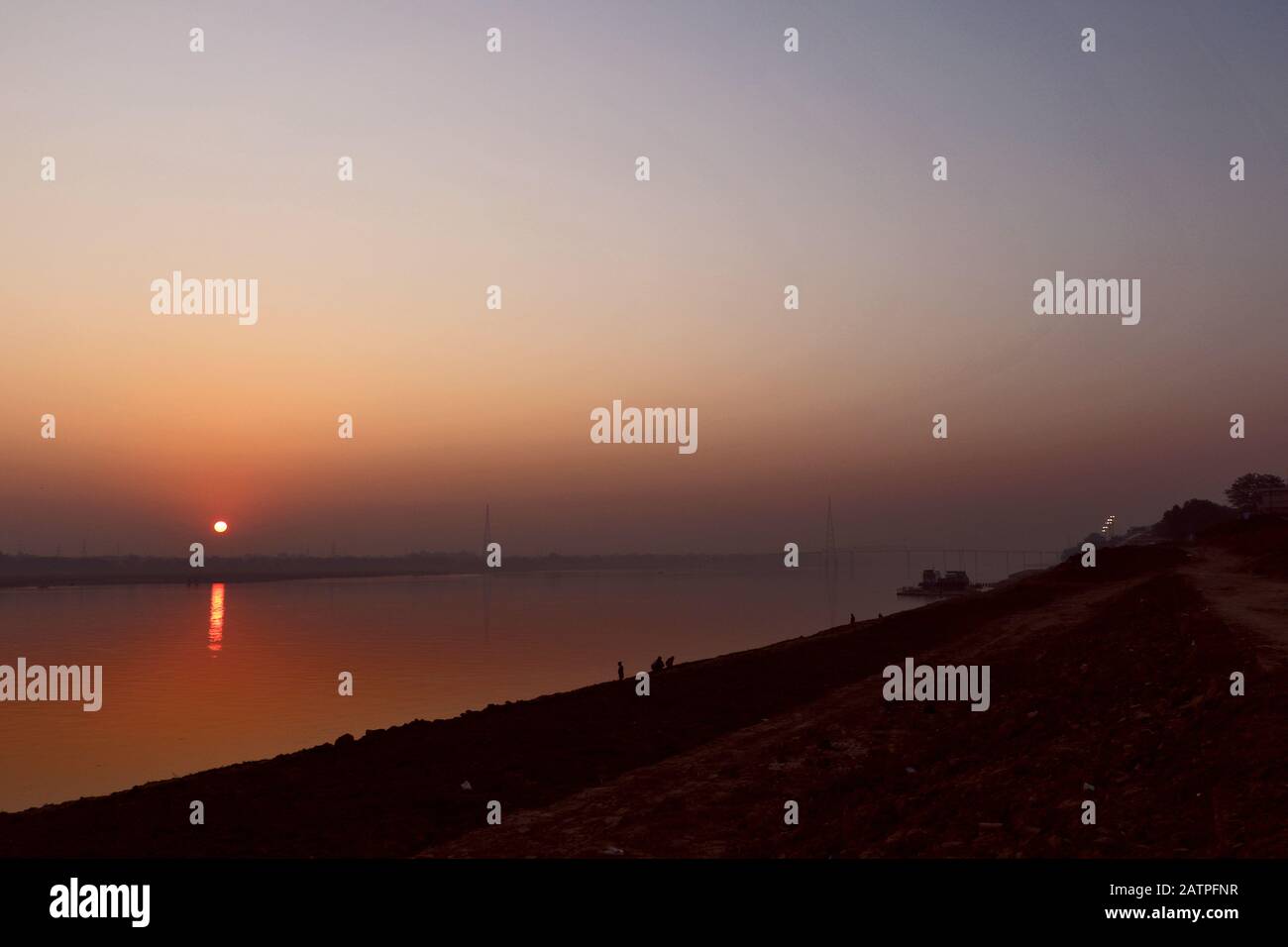 Sun rise in Varanasi opposite Ganga river Stock Photo - Alamy