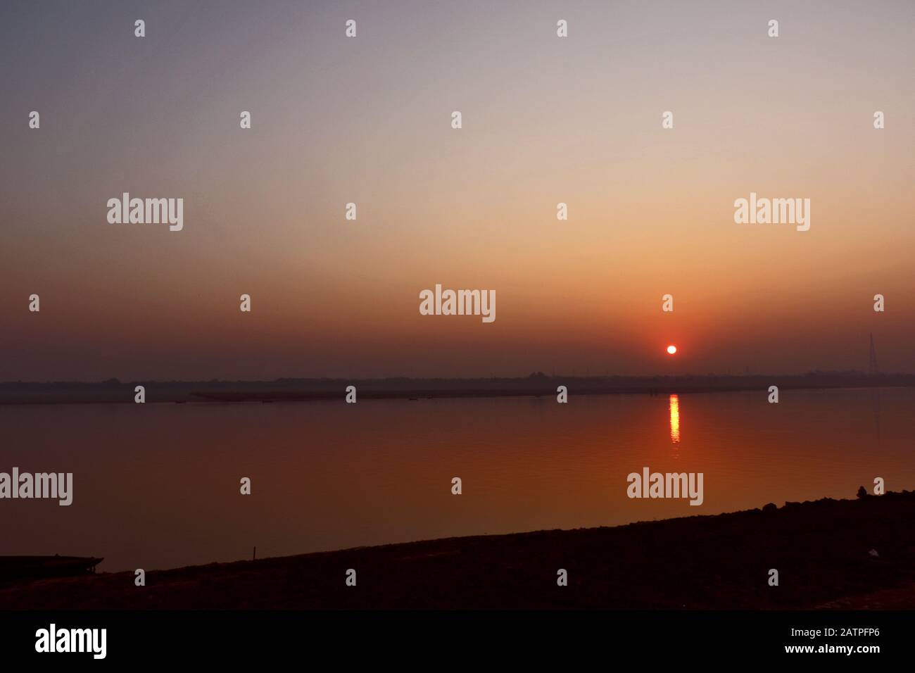 Sun rise in Varanasi opposite Ganga river Stock Photo - Alamy