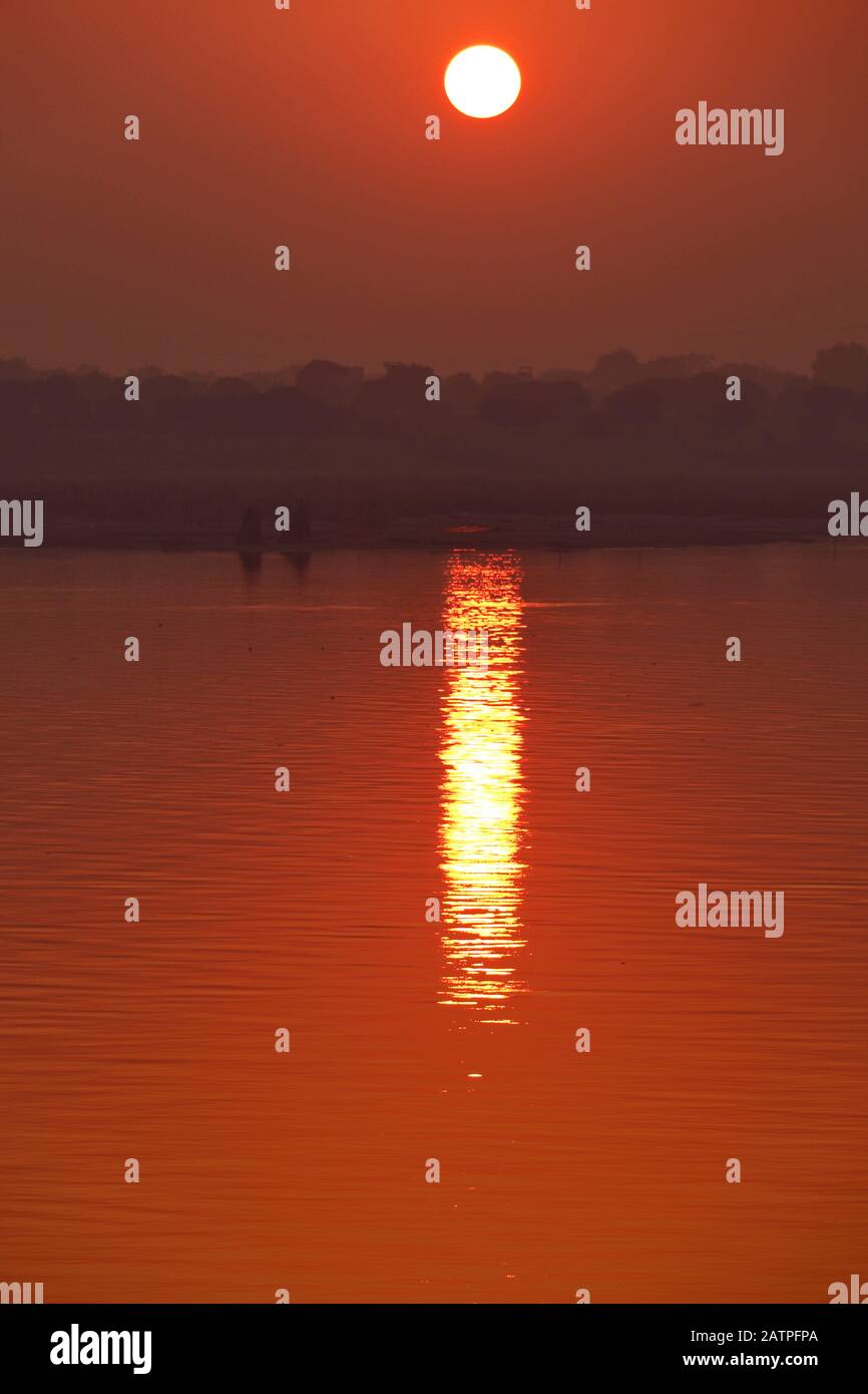 Sun rise in Varanasi opposite Ganga river Stock Photo - Alamy