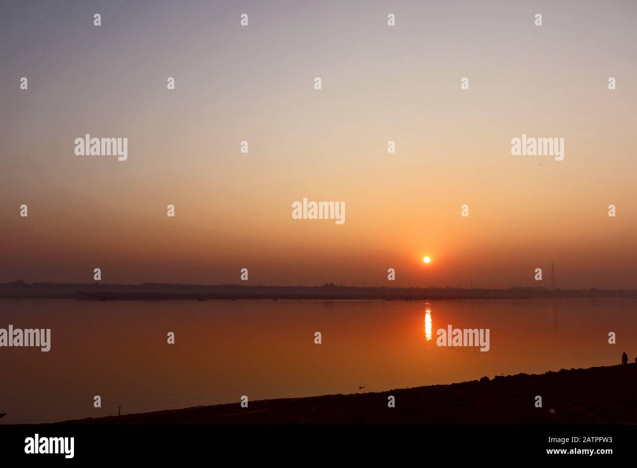 Sun rise in Varanasi opposite Ganga river Stock Photo - Alamy