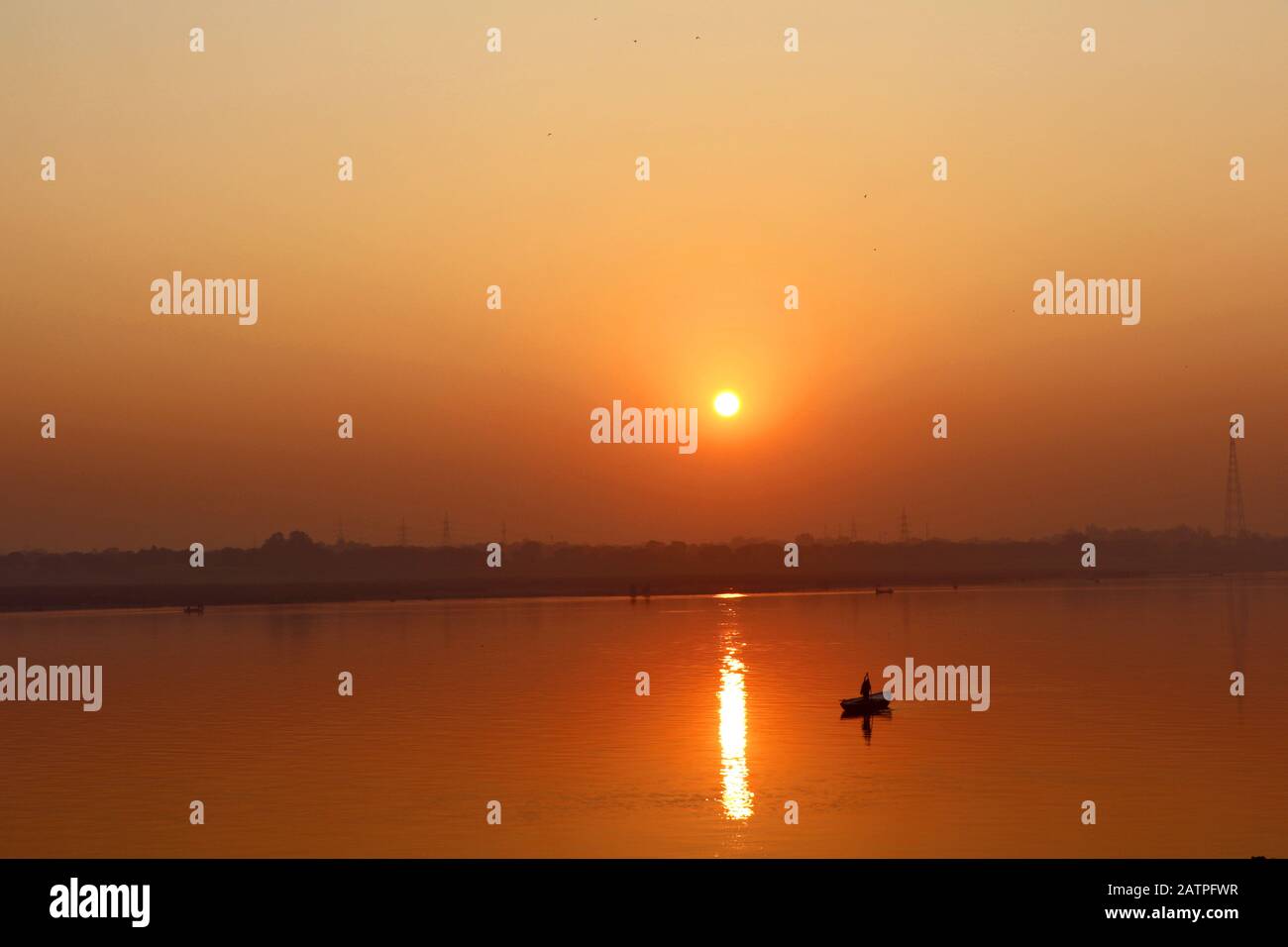 Sun rise in Varanasi opposite Ganga river Stock Photo - Alamy