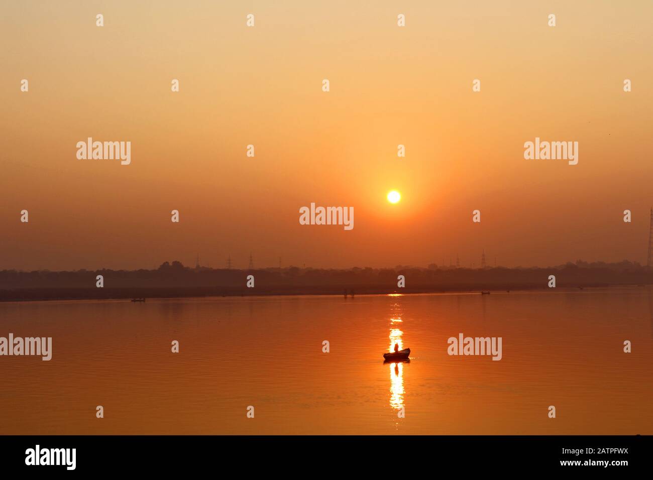 Sun rise in Varanasi opposite Ganga river Stock Photo - Alamy
