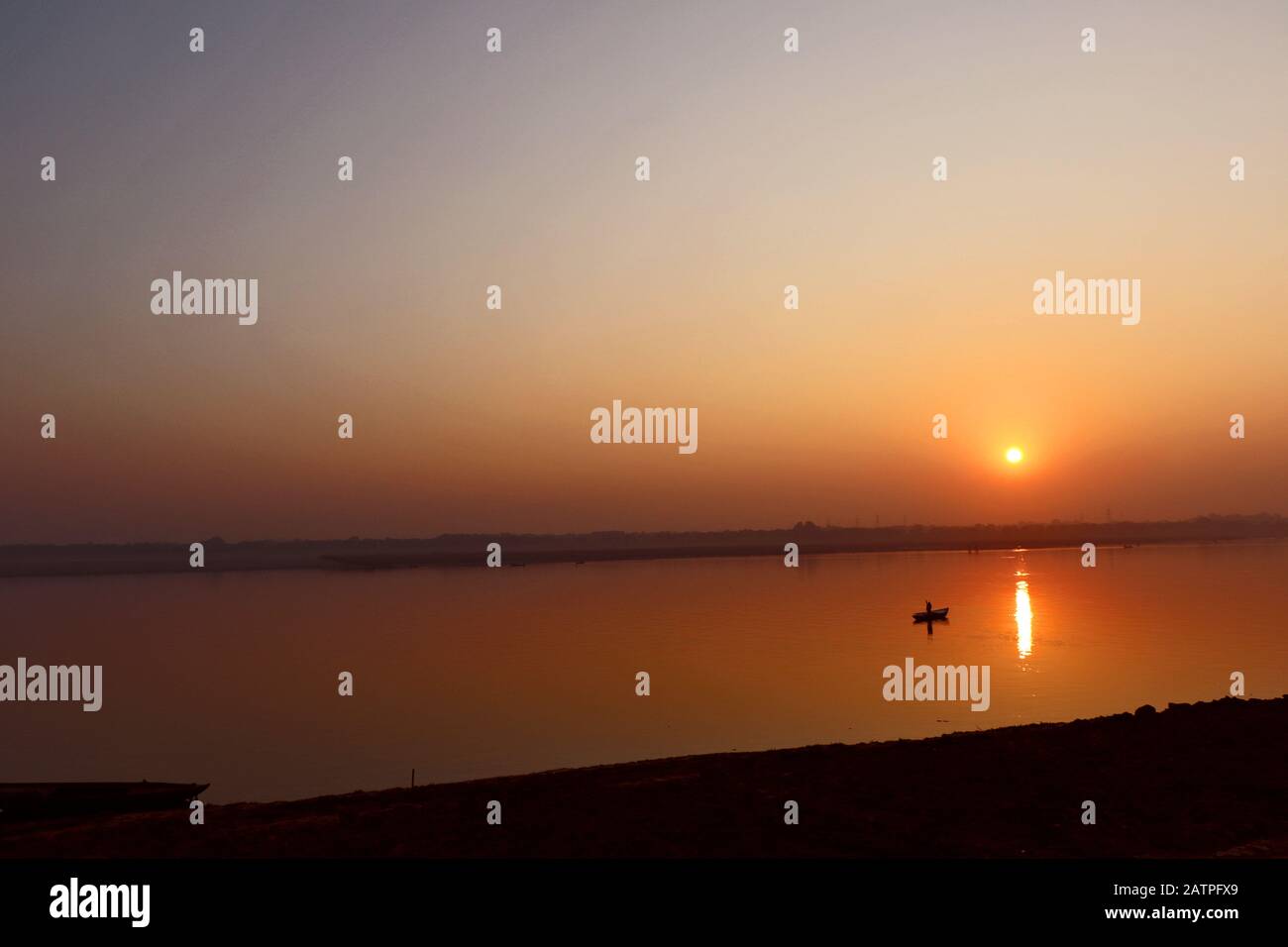 Sun rise in Varanasi opposite Ganga river Stock Photo - Alamy