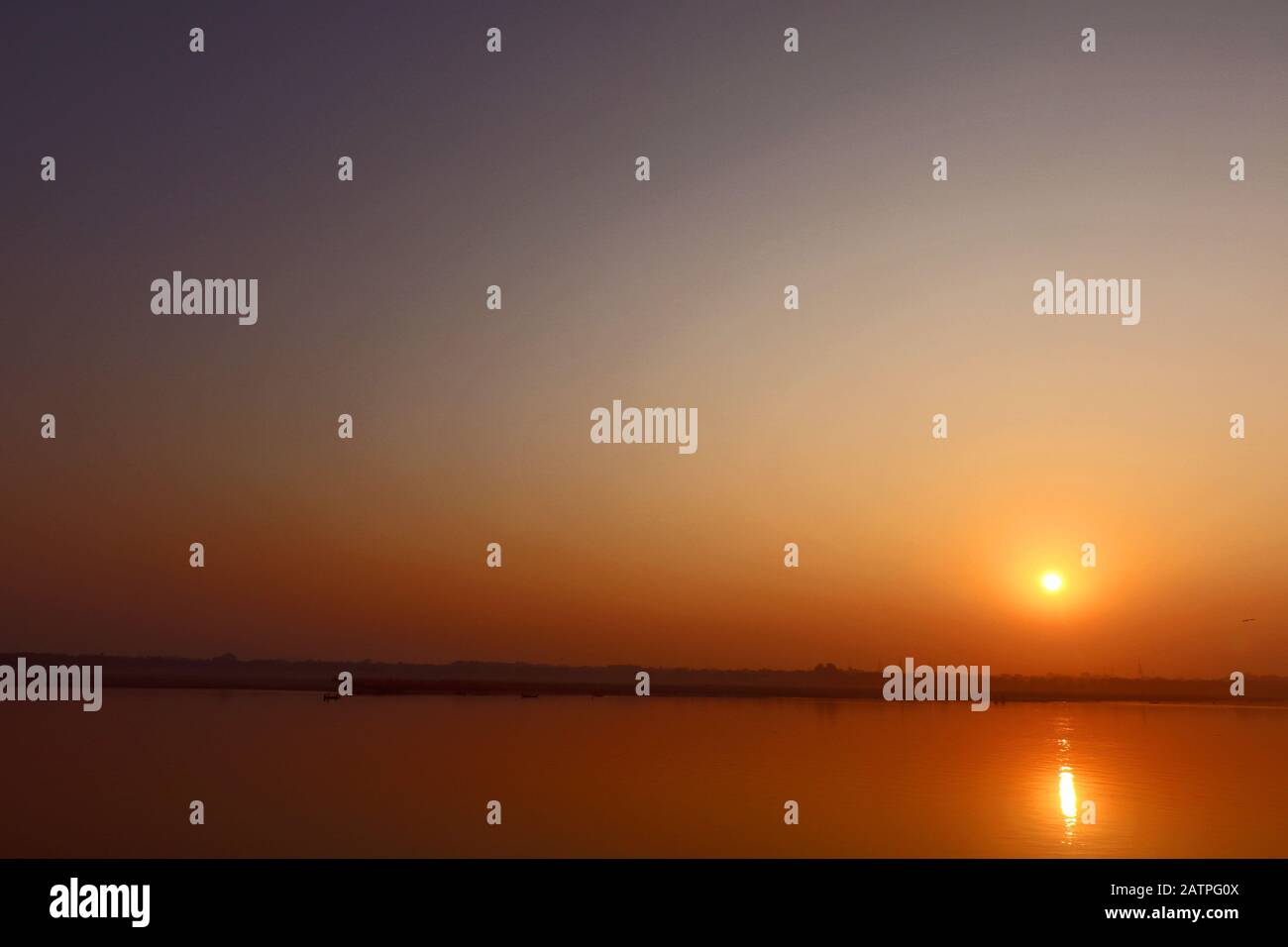 Sun rise in Varanasi opposite Ganga river Stock Photo - Alamy