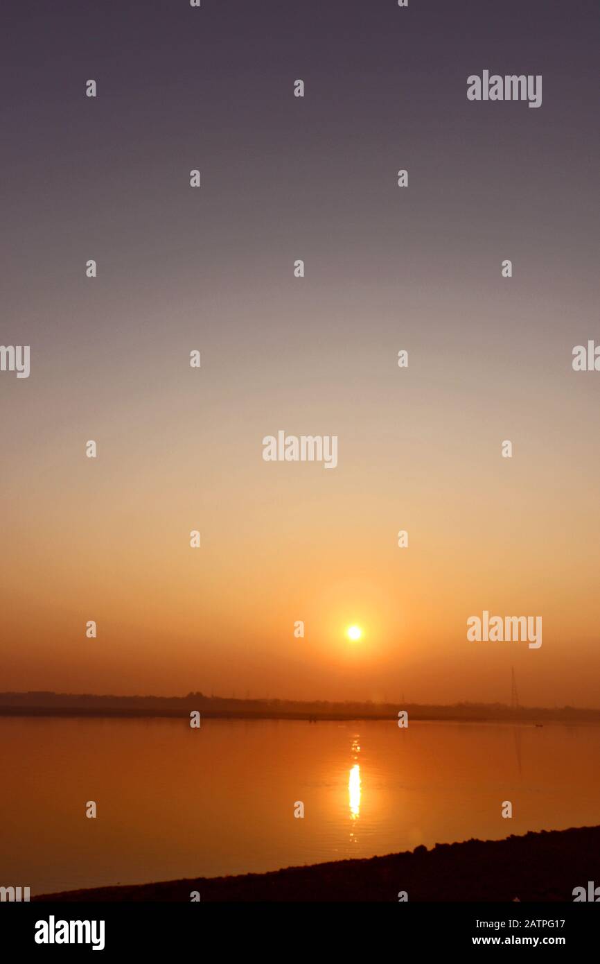 Sun rise in Varanasi opposite Ganga river Stock Photo - Alamy
