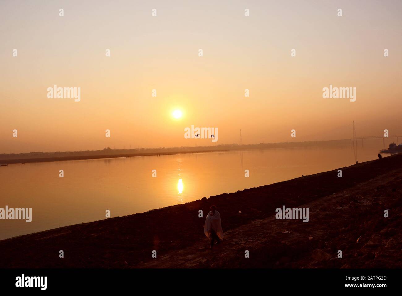 Sun rise in Varanasi opposite Ganga river Stock Photo - Alamy