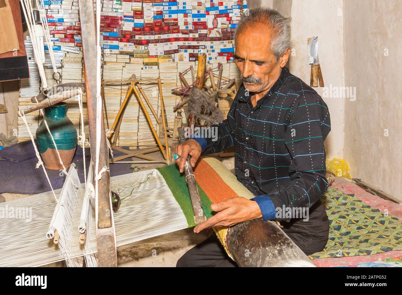 Iranian man working on a loom, Na’in, Isfahan Province, Iran, Asia ...