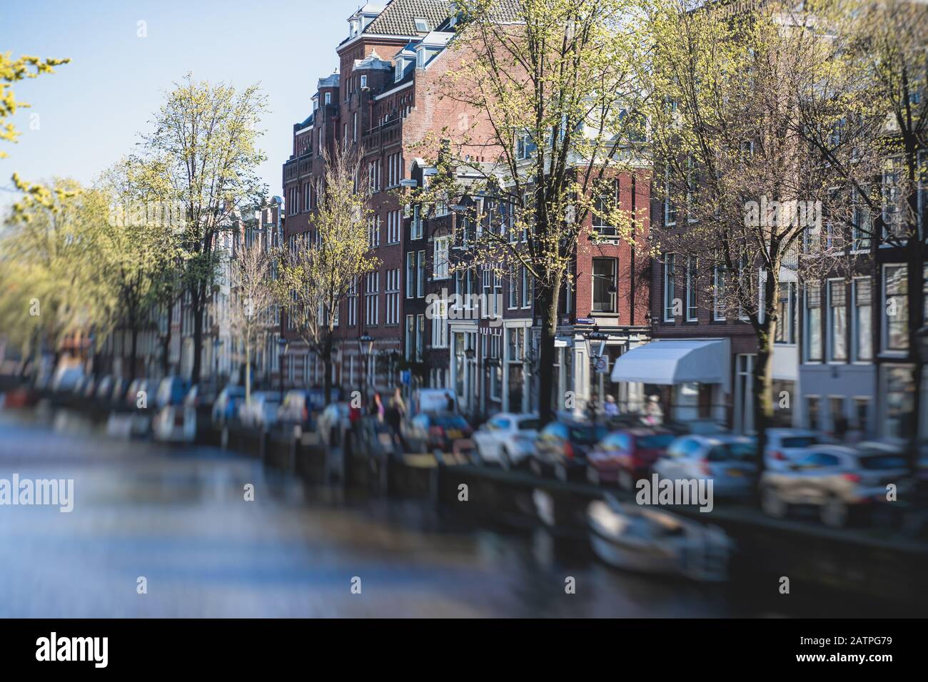 View of Amsterdam street in the historical center, with canal houses in ...