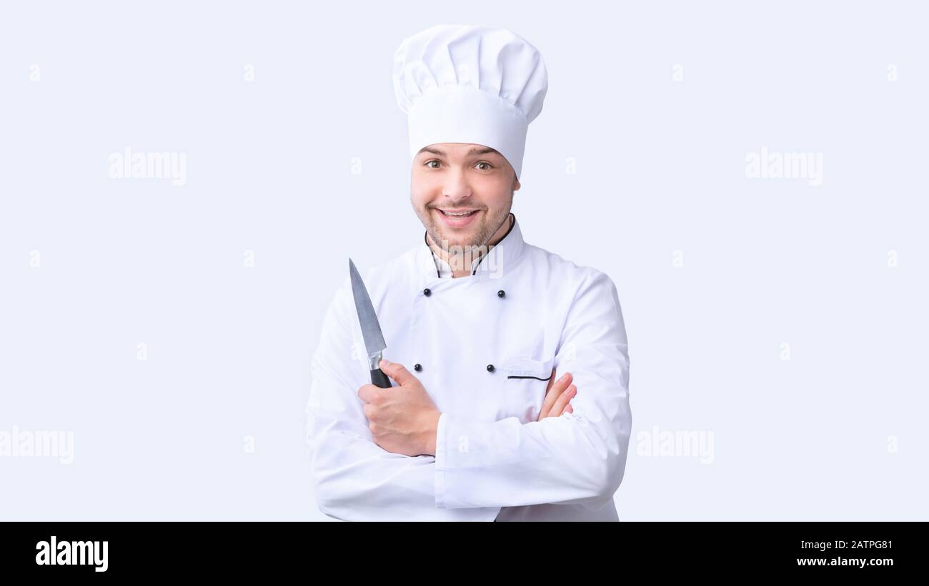 Positive Cook Man Holding Kitchen Knife Standing, Studio Shot Stock ...