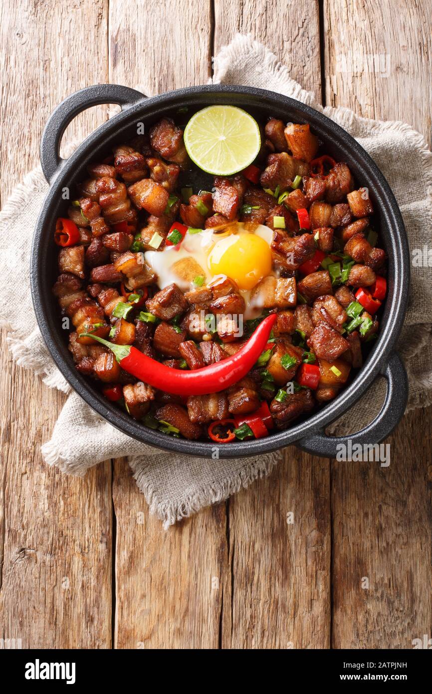 Sisig is a Filipino dish made from parts of pig head and chicken liver ...