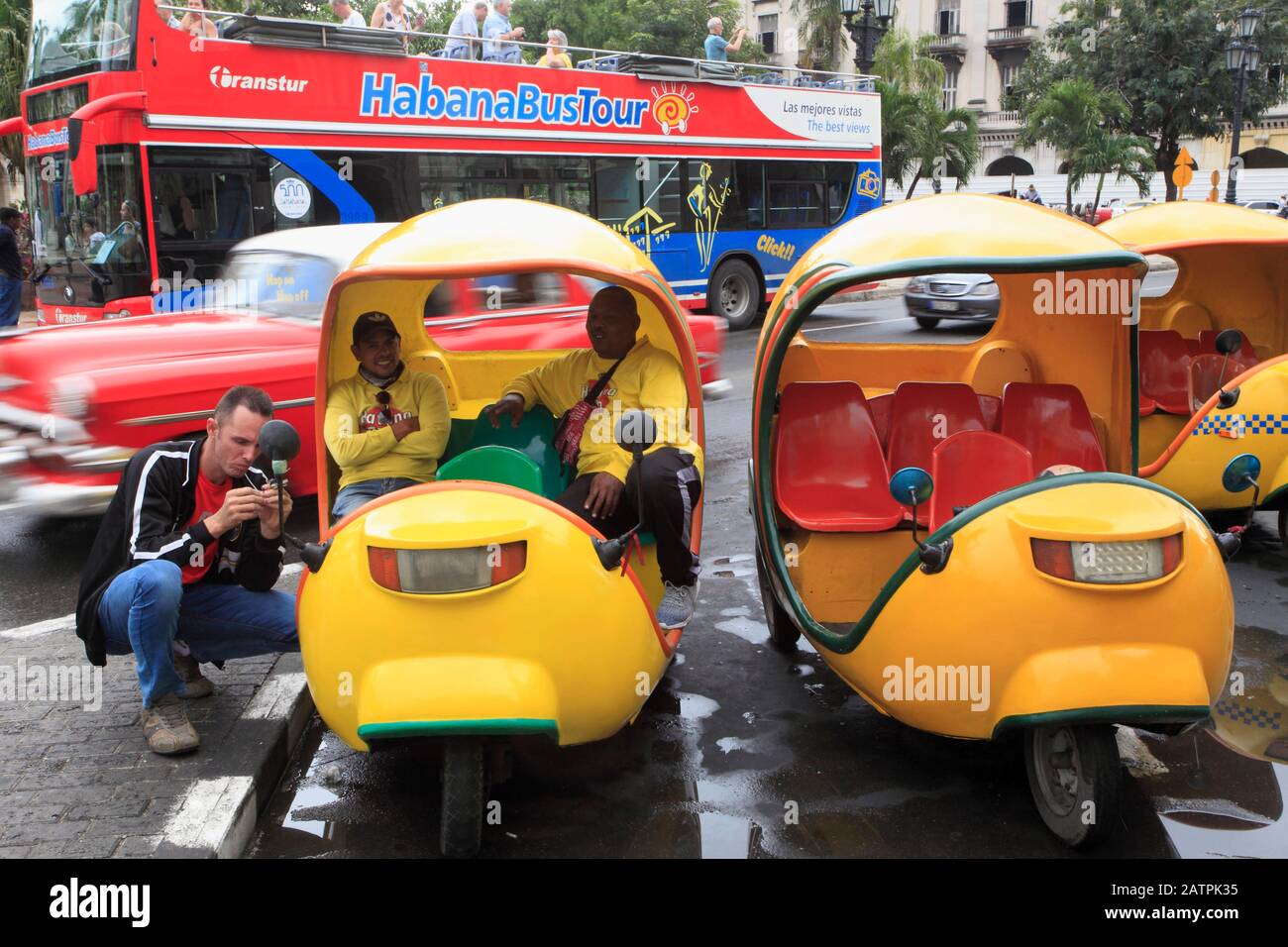 Cuba, Havana, coco taxis, bus tour, traffic Stock Photo - Alamy