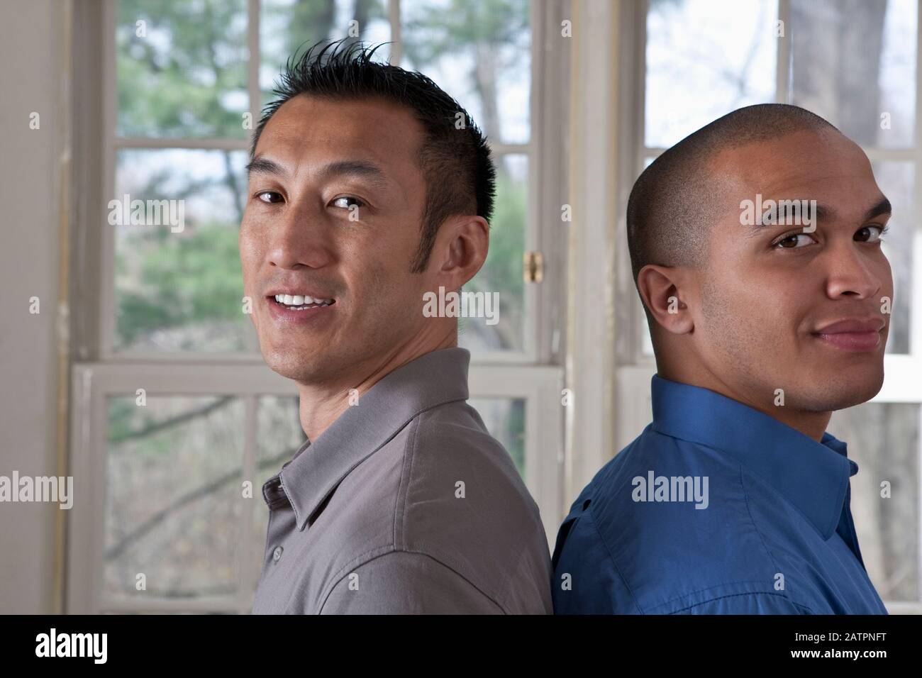 Two business men standing back hi-res stock photography and images - Alamy