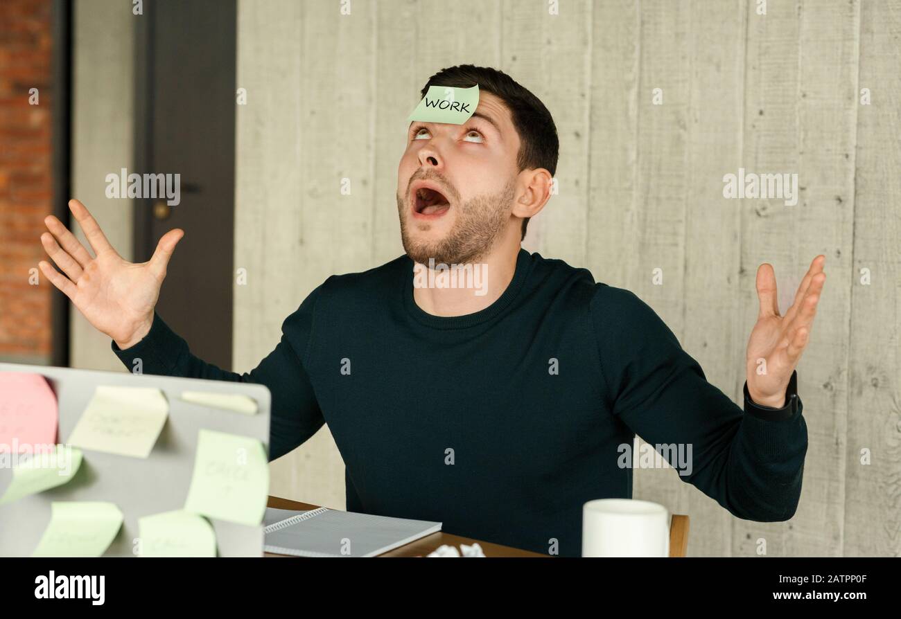 Exhausted Worker Having Sticky Notes Everywhere Sitting At Workplace ...