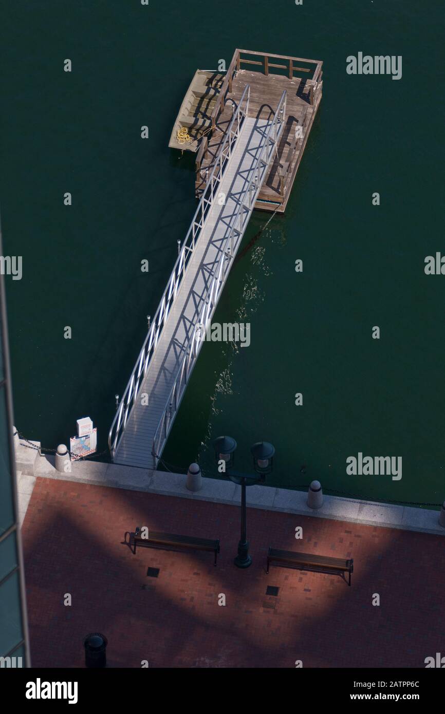 Aerial view of a wheelchair ramp leading out to a wooden dock on the ...