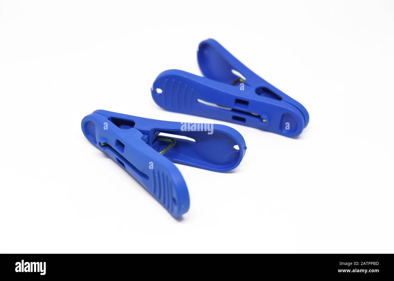 Blue plastic clothespins isolated on white background. Plastic clips ...