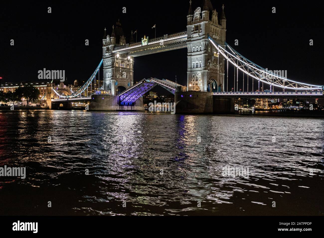 beautiful picture of the Tower Bridge in London at night with open ...