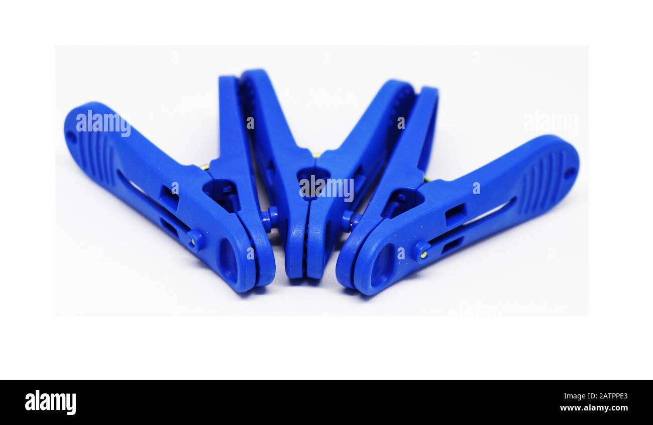 Blue plastic clothespins isolated on white background. Plastic clips ...